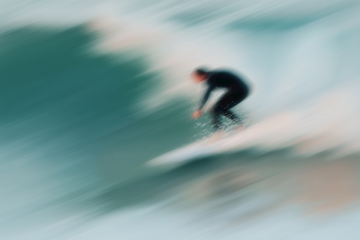 Dynamic Surfing Motion Wallpaper