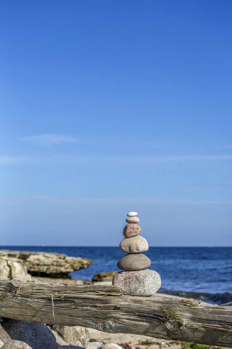 Rock Balancing Beach Sweden 2 Wallpaper | Happywall